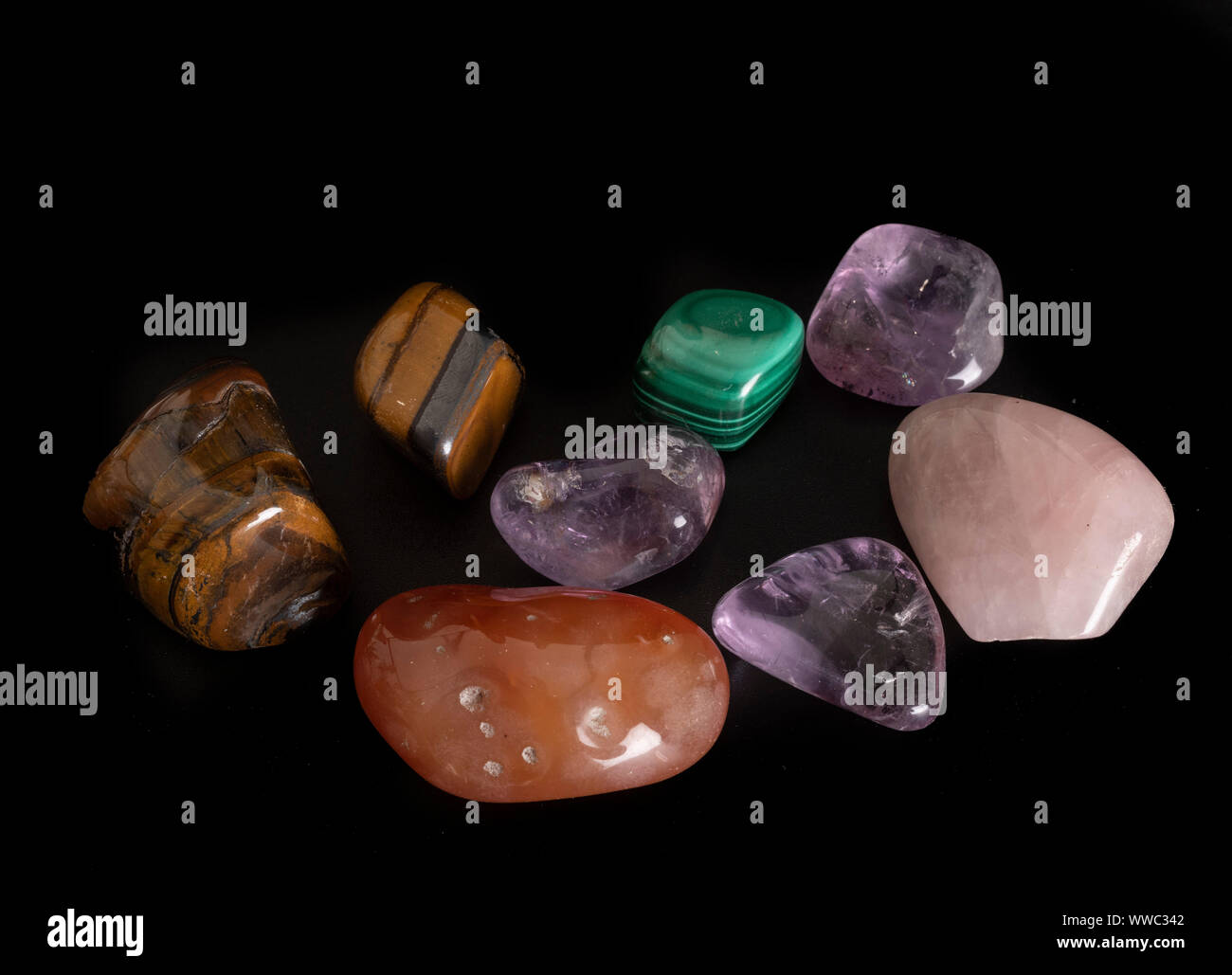 polished gems in front of black background Stock Photo - Alamy