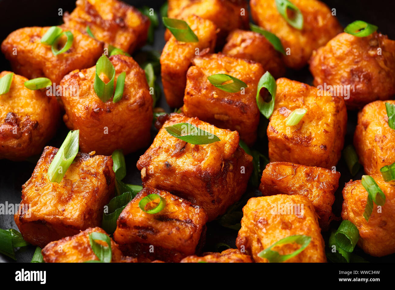 Paneer Manchurian or Paneer 65 in bowl at black concrete background ...