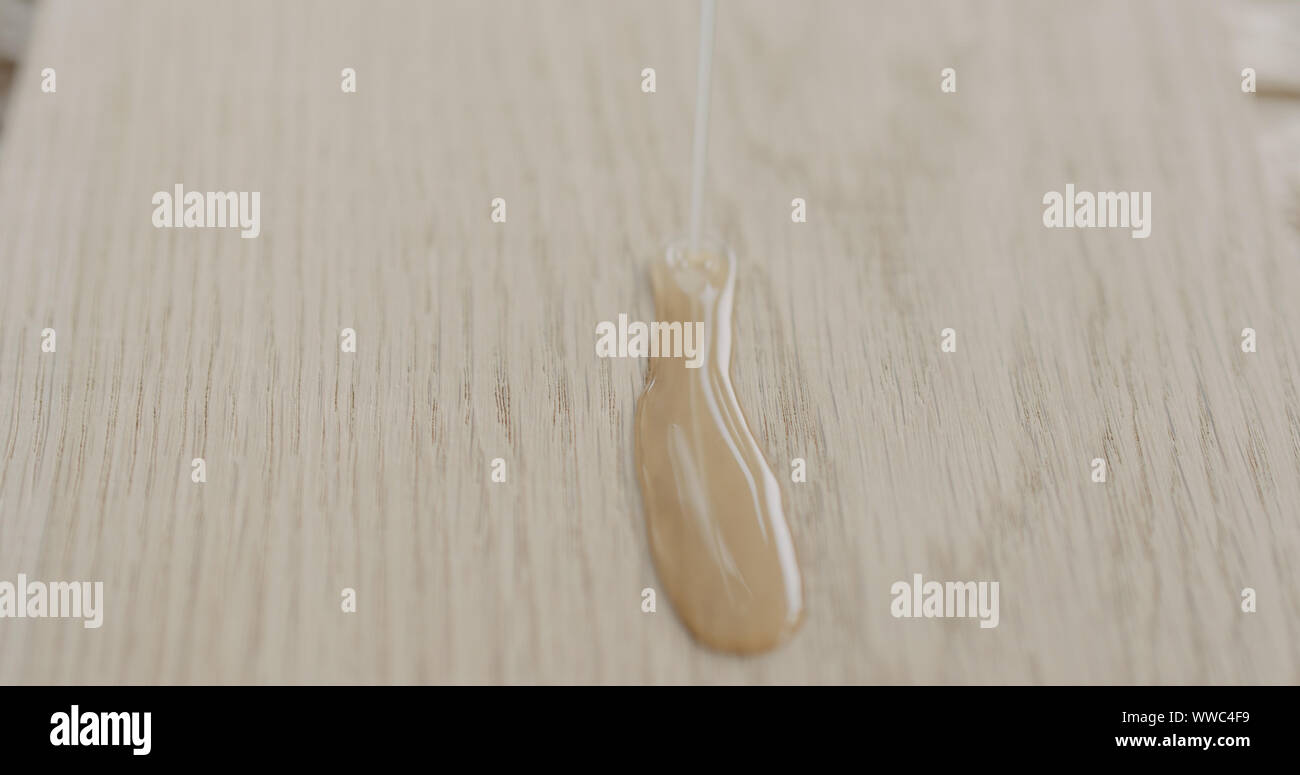 pour oil onto white oak board, wide photo Stock Photo - Alamy