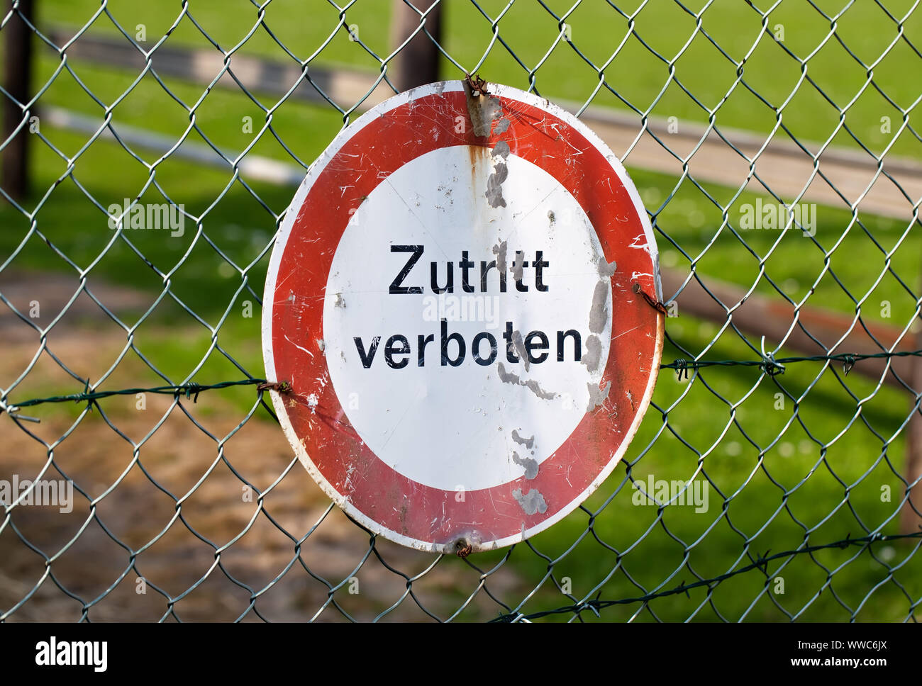 old german sign fixed at a fence "Zutritt verboten Stock Photo - Alamy
