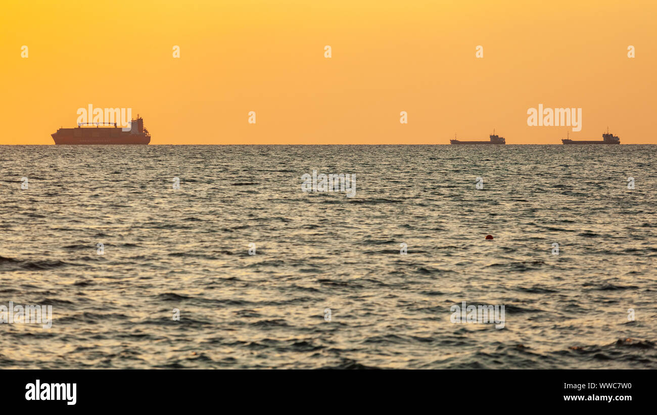 Ship on the horizon of the Black Sea, Poti, Georgia. Sunset Stock Photo ...
