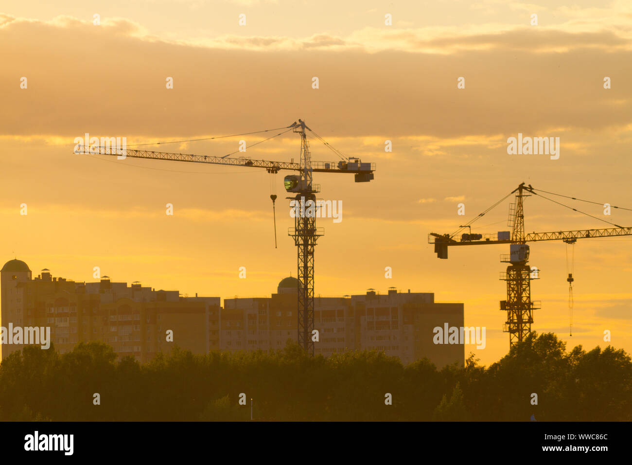 construction site on sunset in yellow sunlight Stock Photo - Alamy