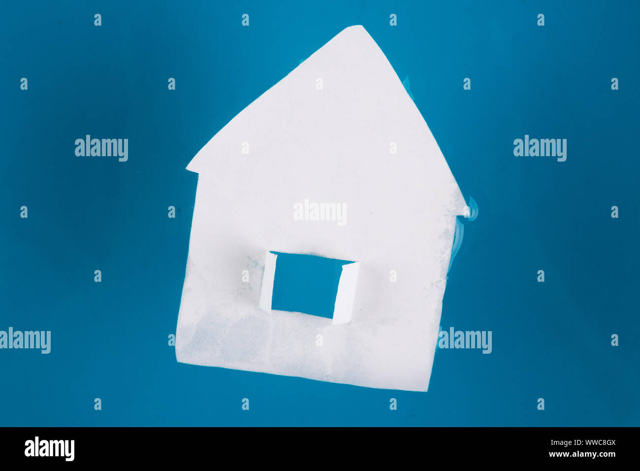 Flood concept image. Paper house in water Stock Photo - Alamy