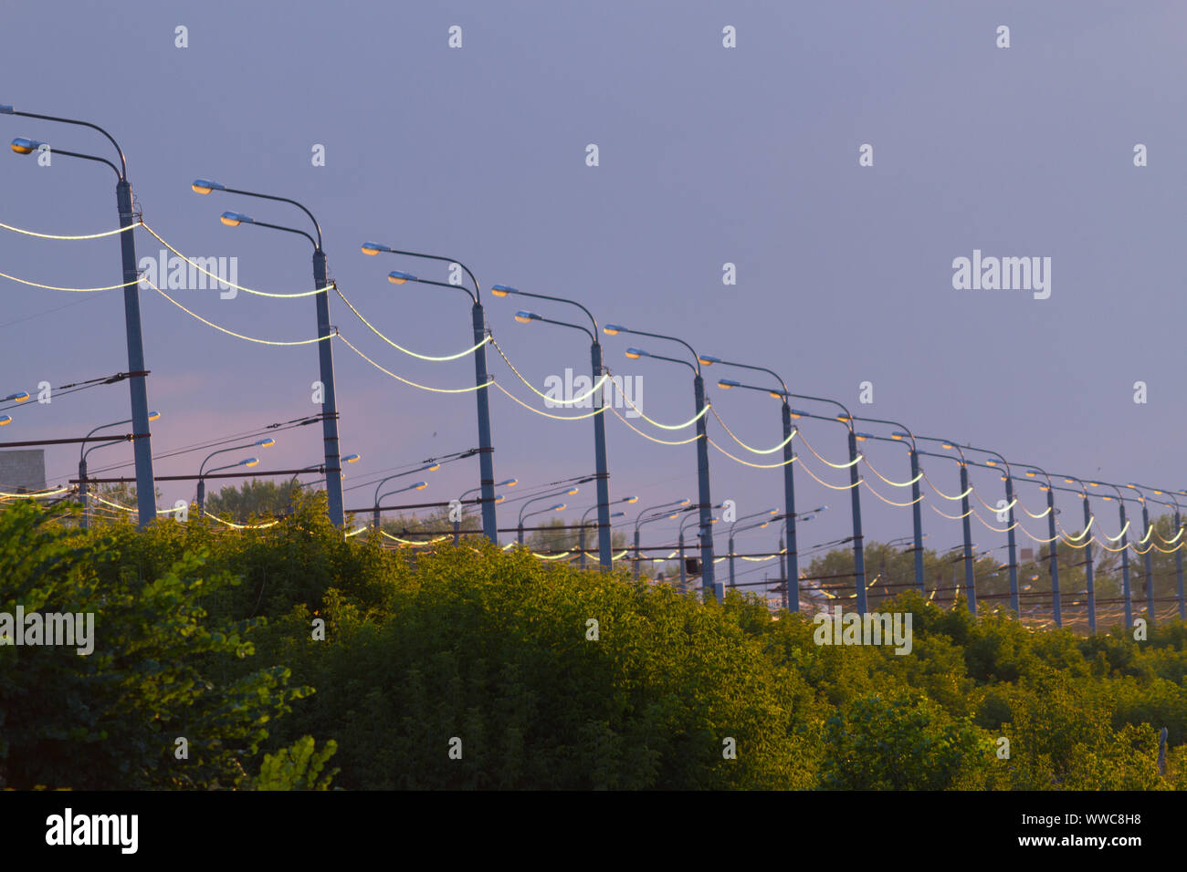 Street illumination on road. Line of street lantern Stock Photo - Alamy