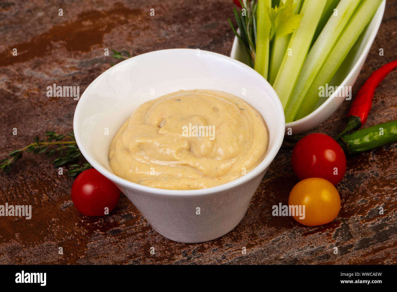 Vegan cuisine - Humus with celery sticks Stock Photo - Alamy