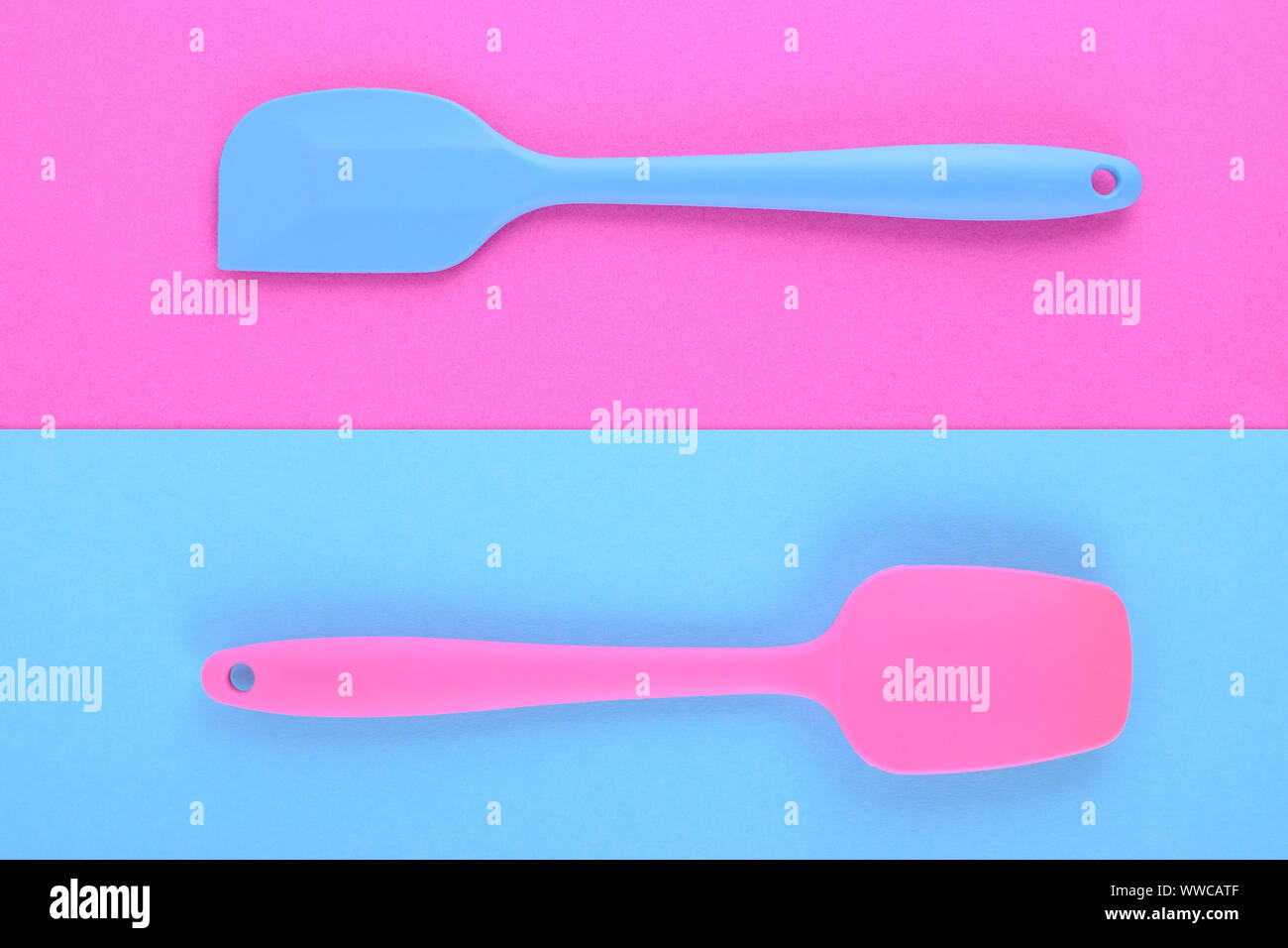 bright kitchen utensils on pink and blue background, creative idea ...