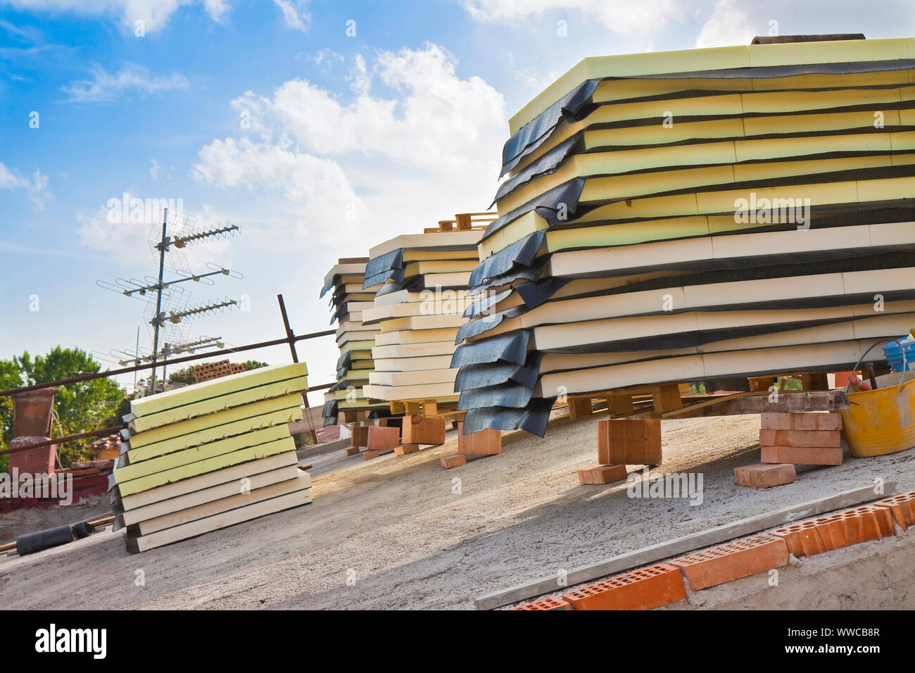 Italian construction site with roof thermal insulation and polystyrene ...