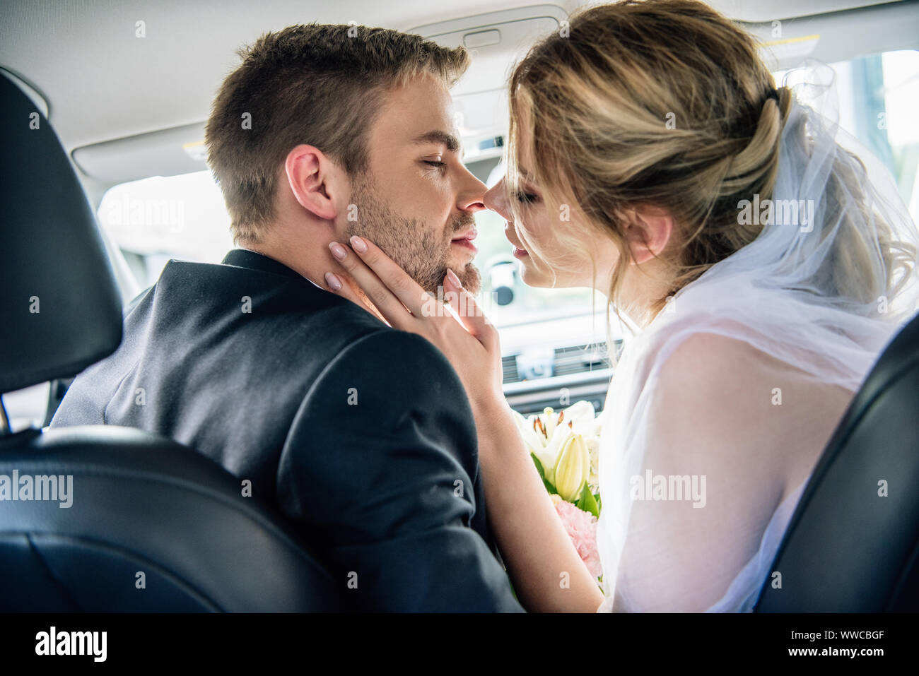 Girl kissing woman back view hi-res stock photography and images - Alamy