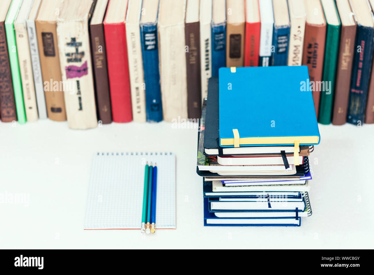 Notebooks piles, stack of books education back to school background ...
