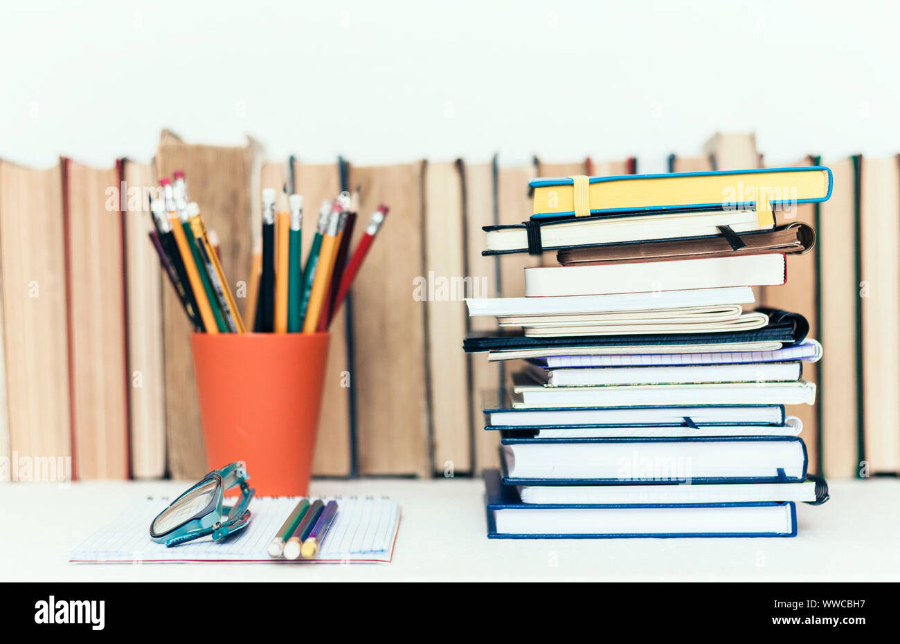 Notebooks piles, stack of books education back to school background ...