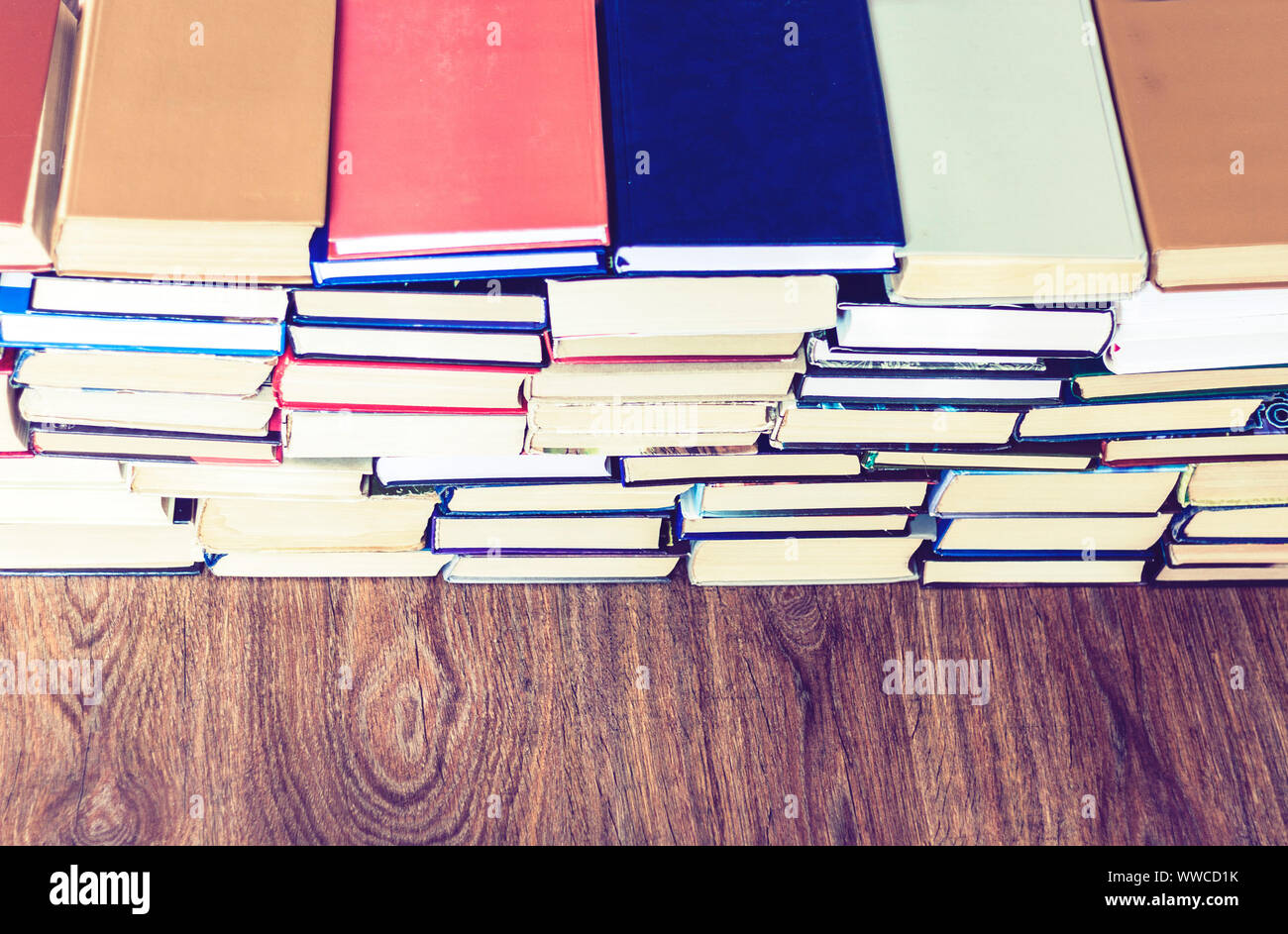 Stack of old book education concept background, many books piles with ...
