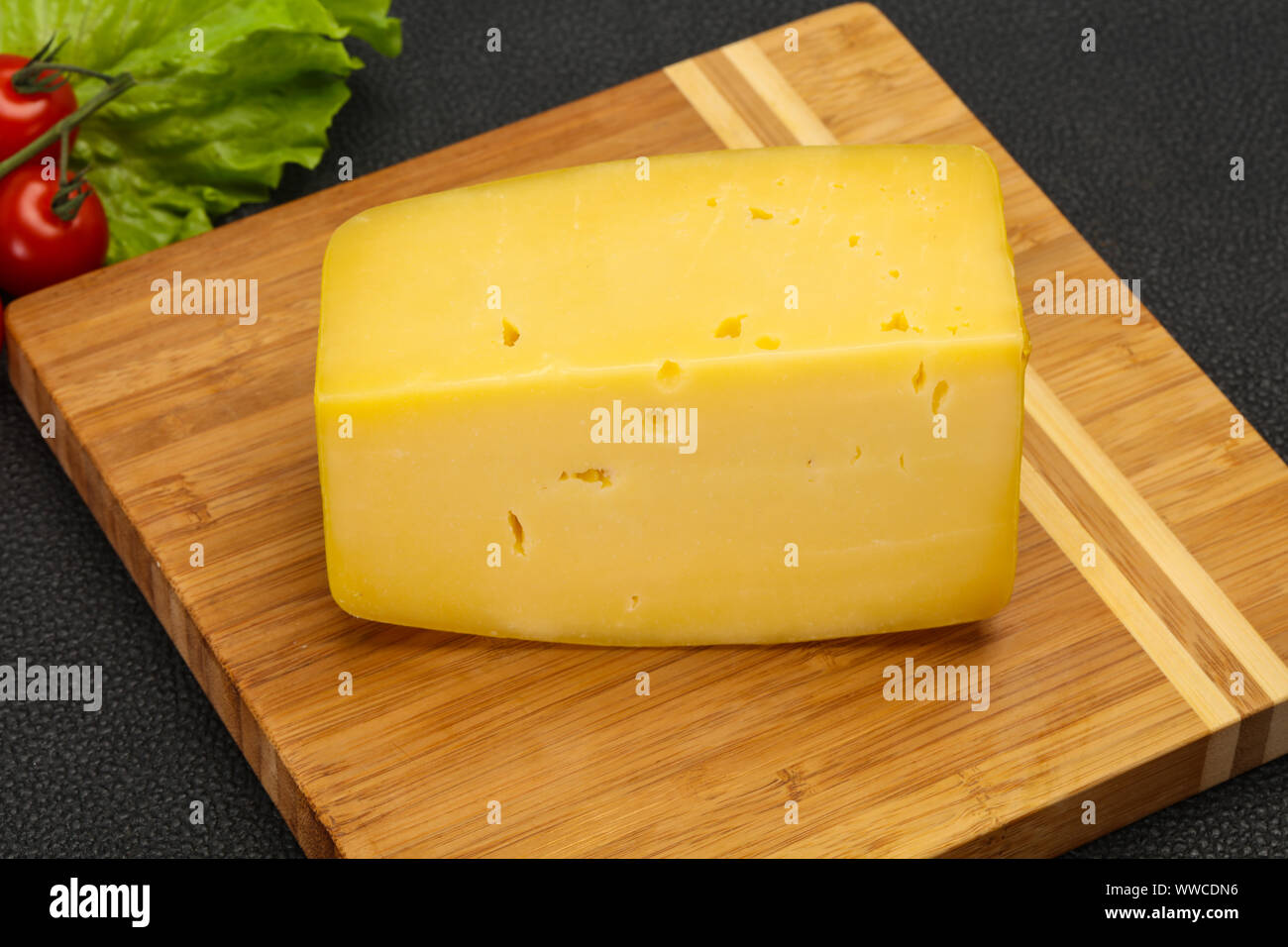 Swiss Hard yellow tasty cheese brick Stock Photo - Alamy