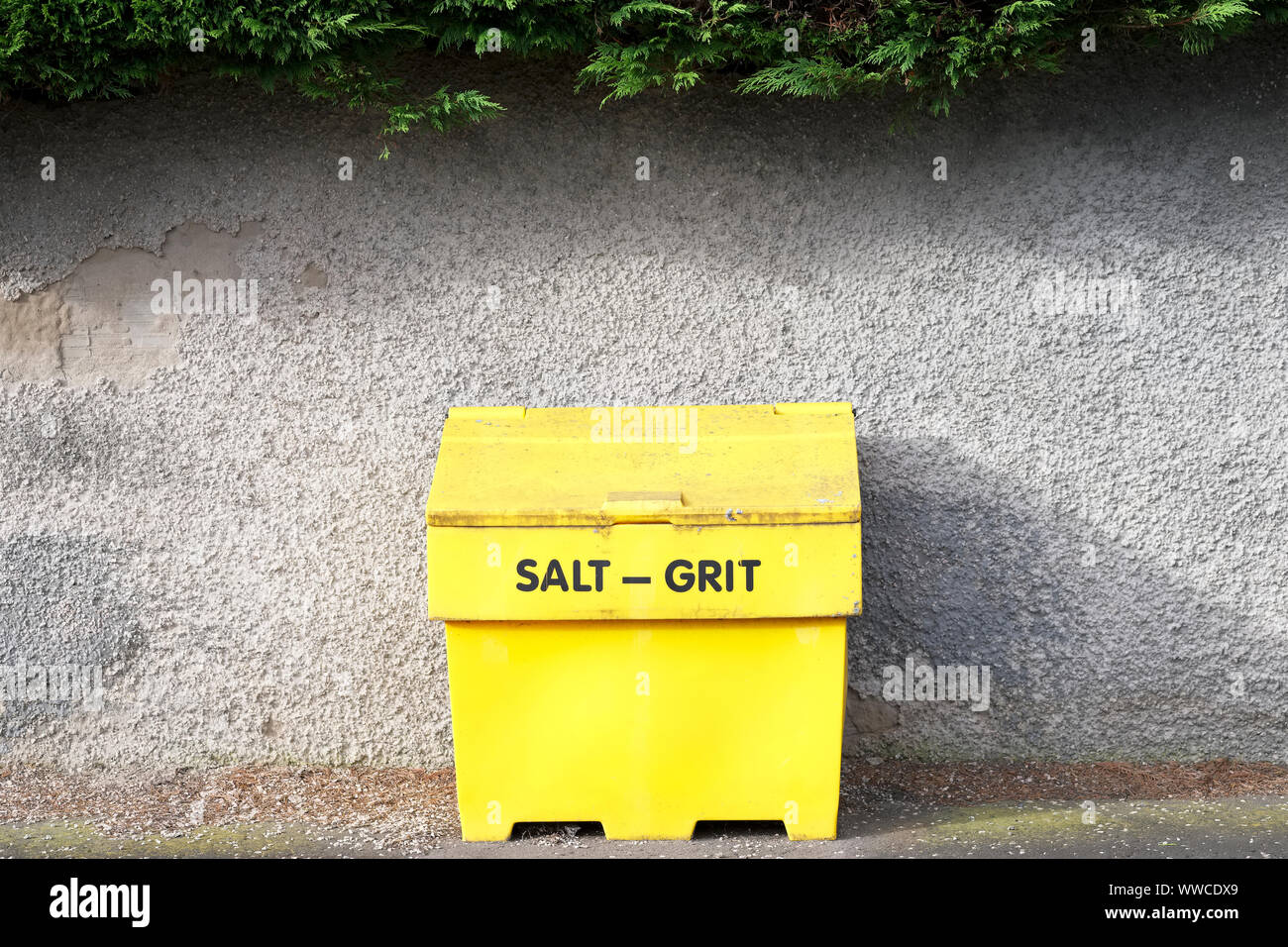 Salt grit yellow container for winter road safety on council road uk ...