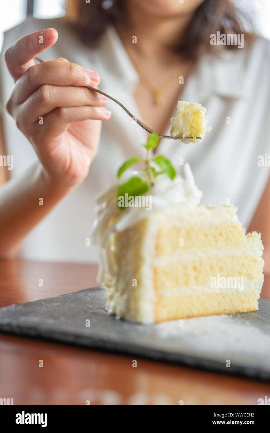 Asian beauty Scooping the cake to eat In Caffe Holiday idea Eating ...