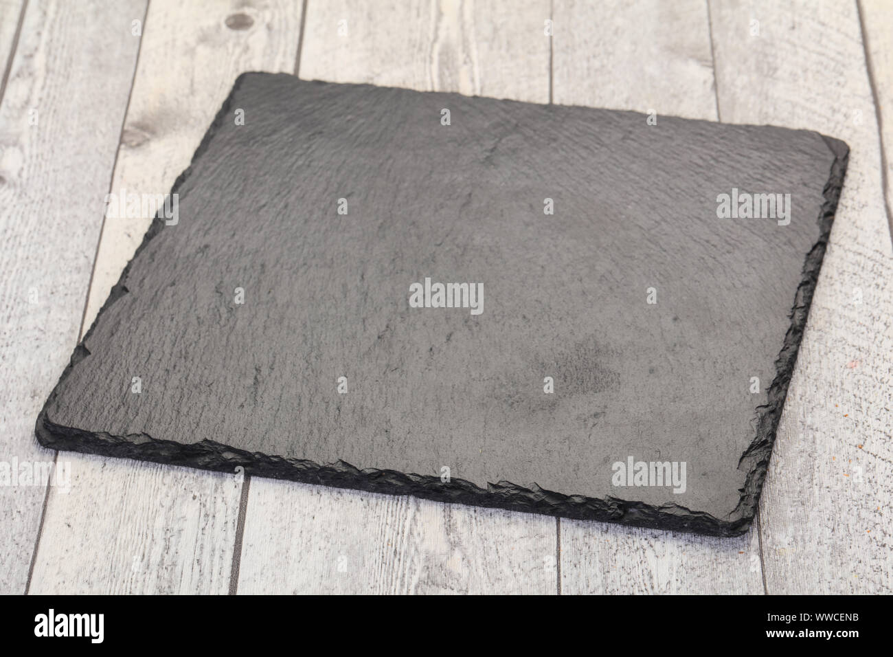 Stone board for serving dishes - kitchenware Stock Photo - Alamy