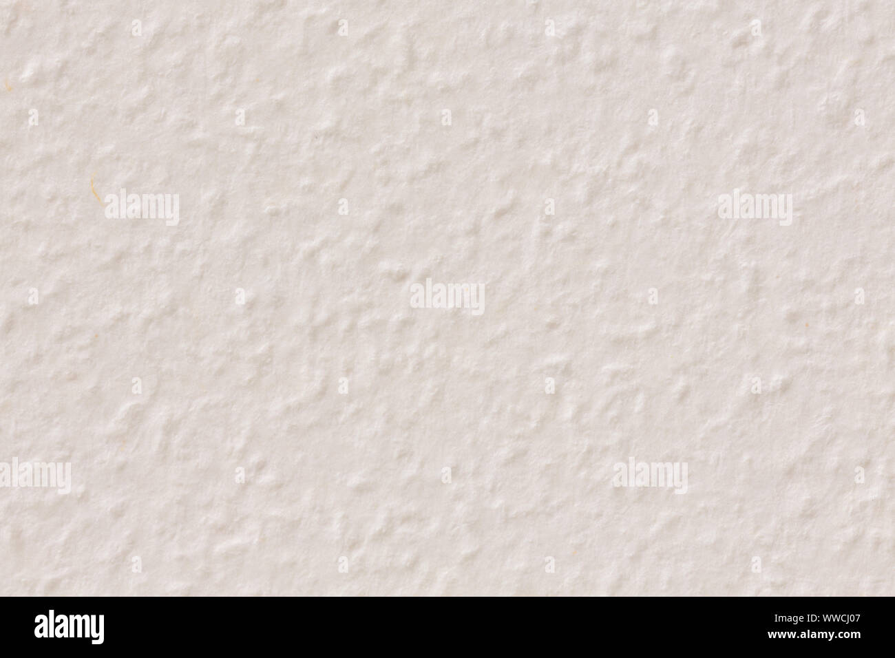 A warm-toned, off-white paper background with a finely textured ...