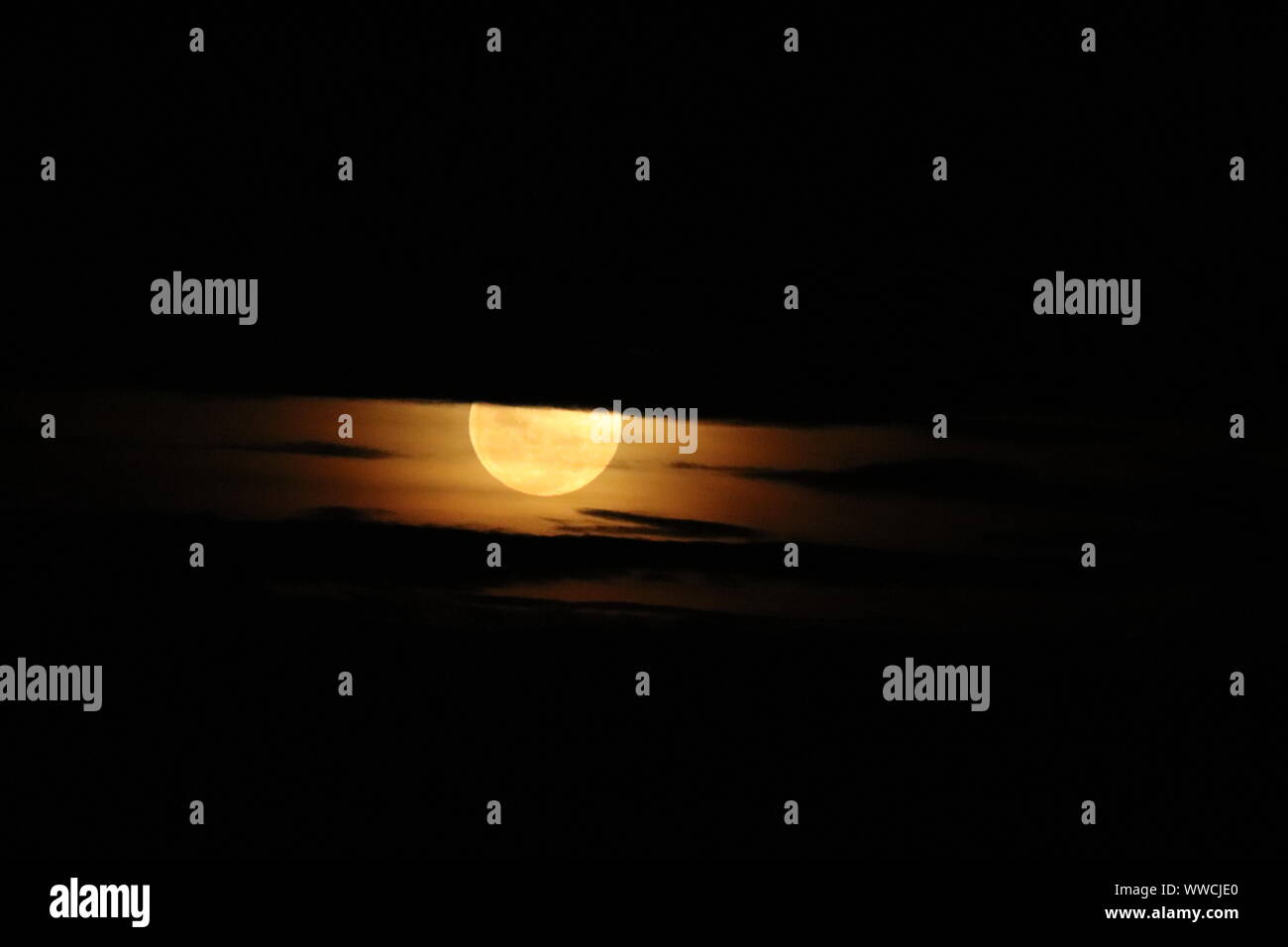 Moonrise and clouds Stock Photo - Alamy
