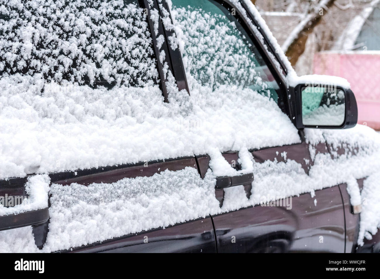 Snow-covered red car Stock Photo - Alamy