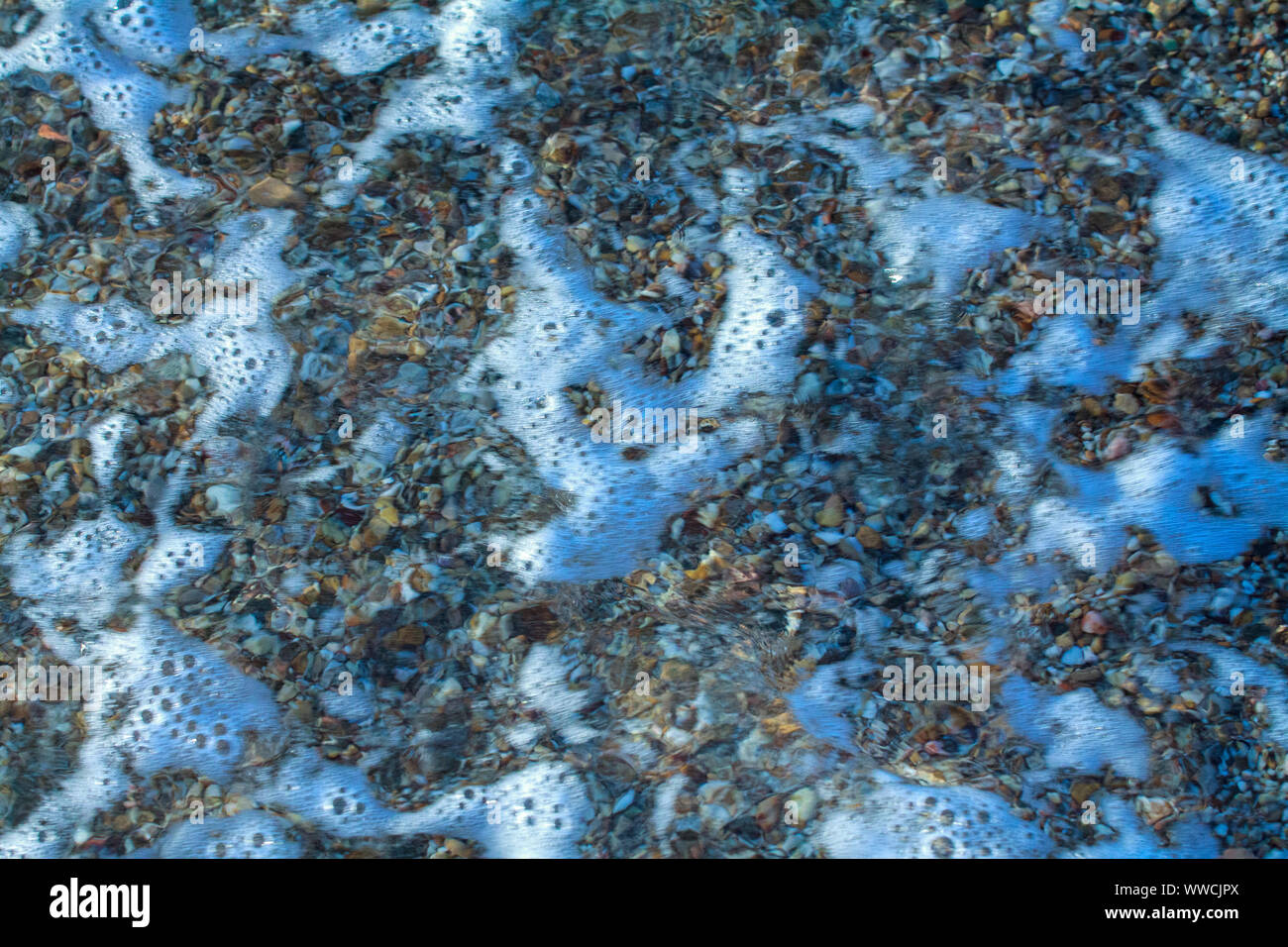 sea pebbles colored granite on the beach background stones. The shore ...