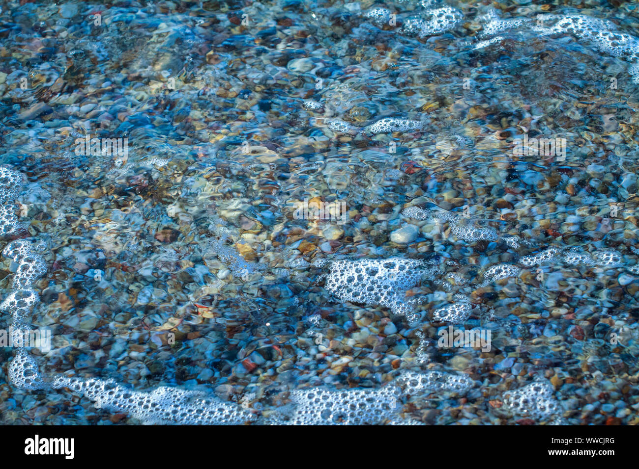 sea pebbles colored granite on the beach background stones. The shore ...