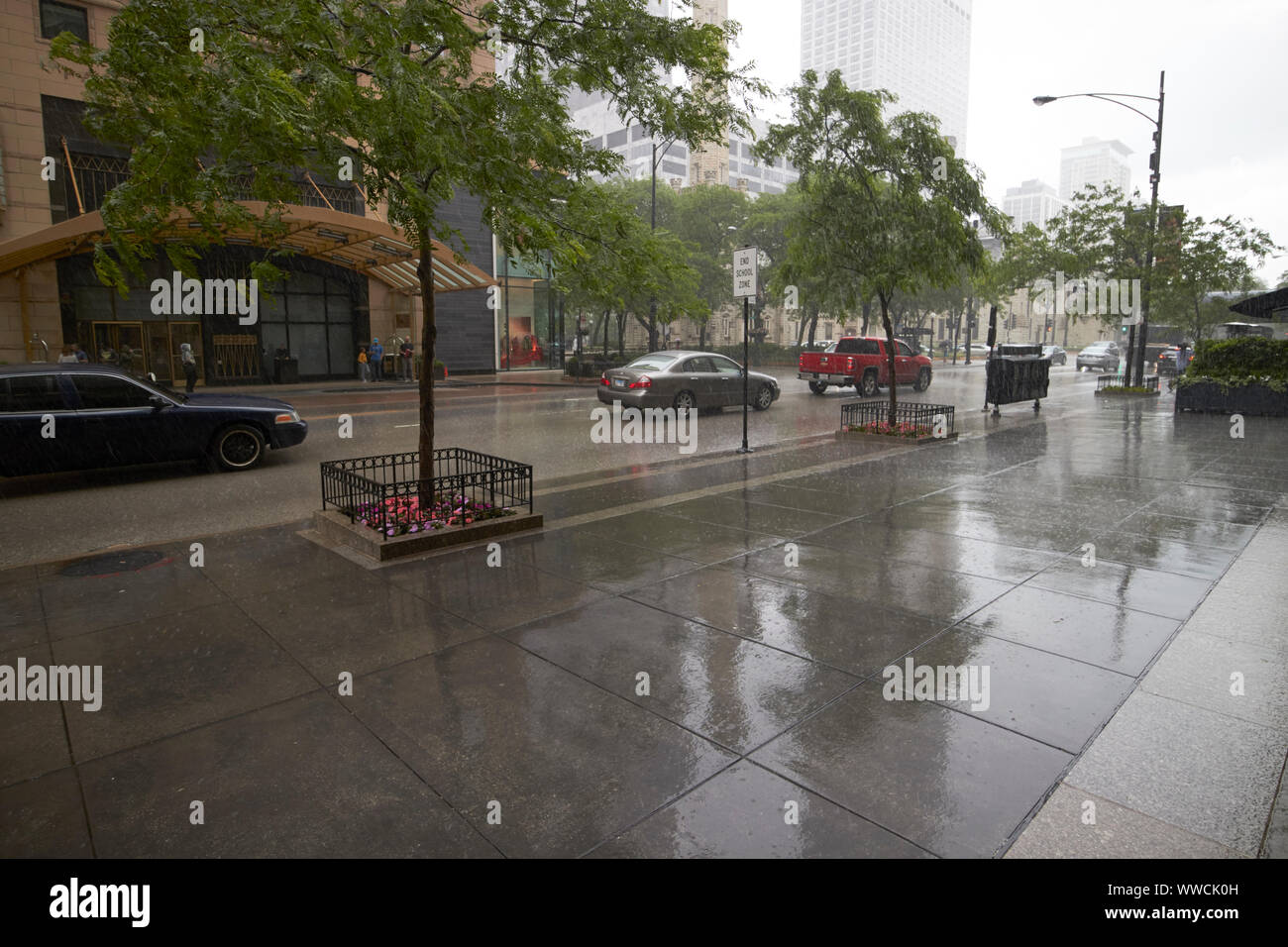 torrential rain falling on sidewalk in downtown Chicago Illinois USA ...