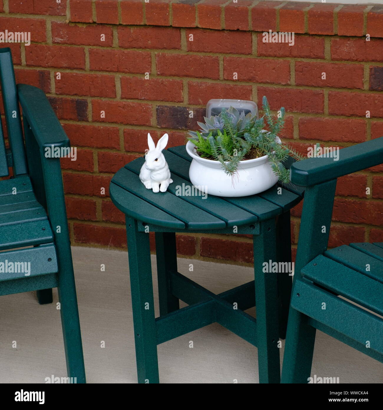 White Pot and Rabbit on Green Table Stock Photo - Alamy