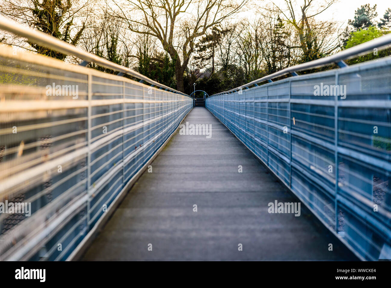 pedestrian bridge over uk motorway in evening england Stock Photo - Alamy