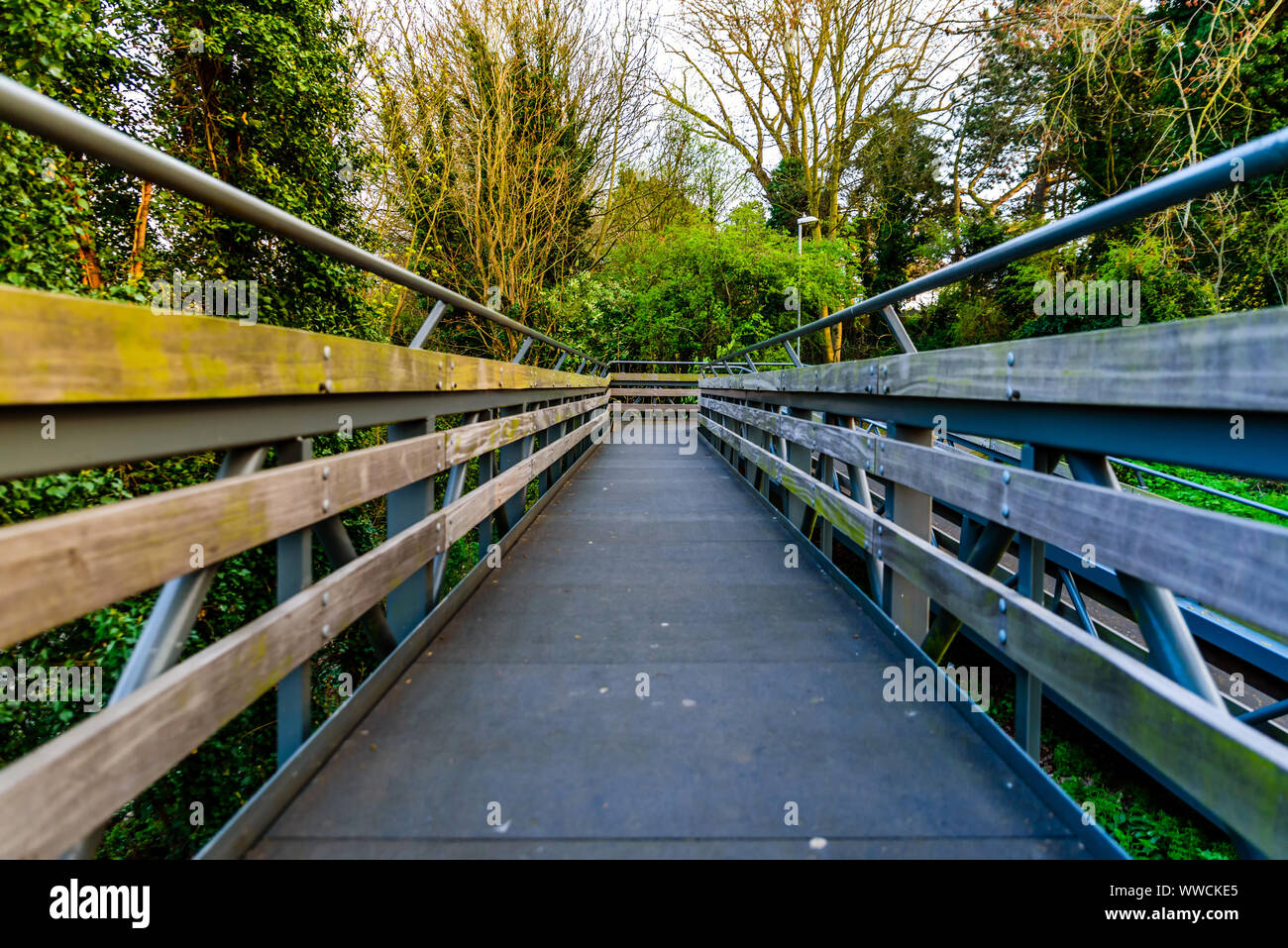pedestrian bridge over uk motorway in evening england Stock Photo - Alamy