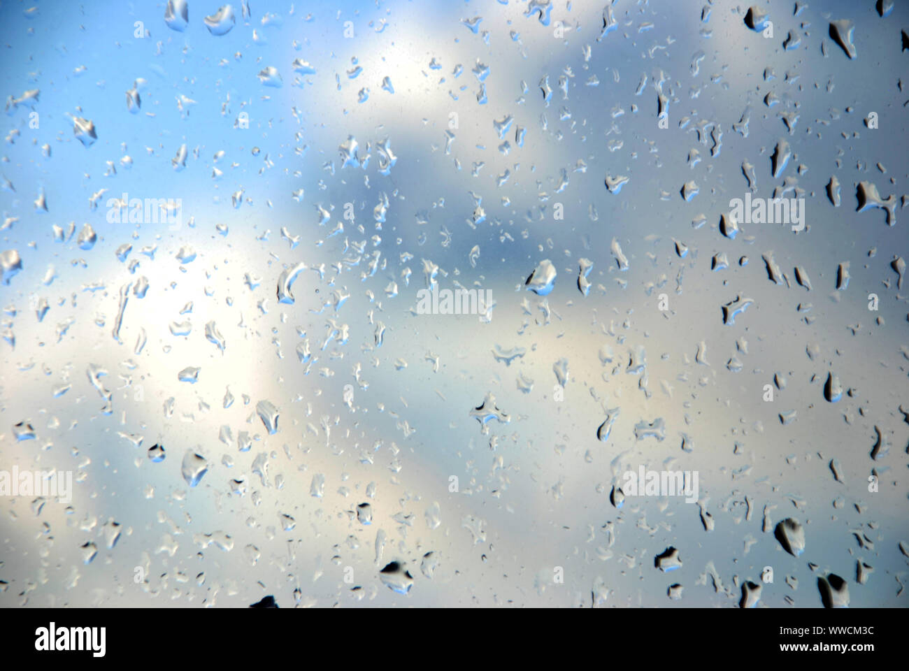 Drops of water and irregular water patterns in the glass Windows on the ...