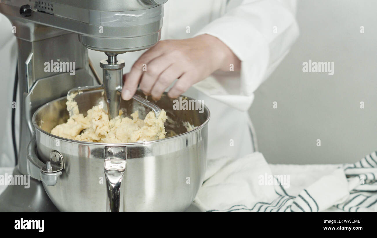 Step by step. Mixing ingredients in standing kitchen mixer to bake ...