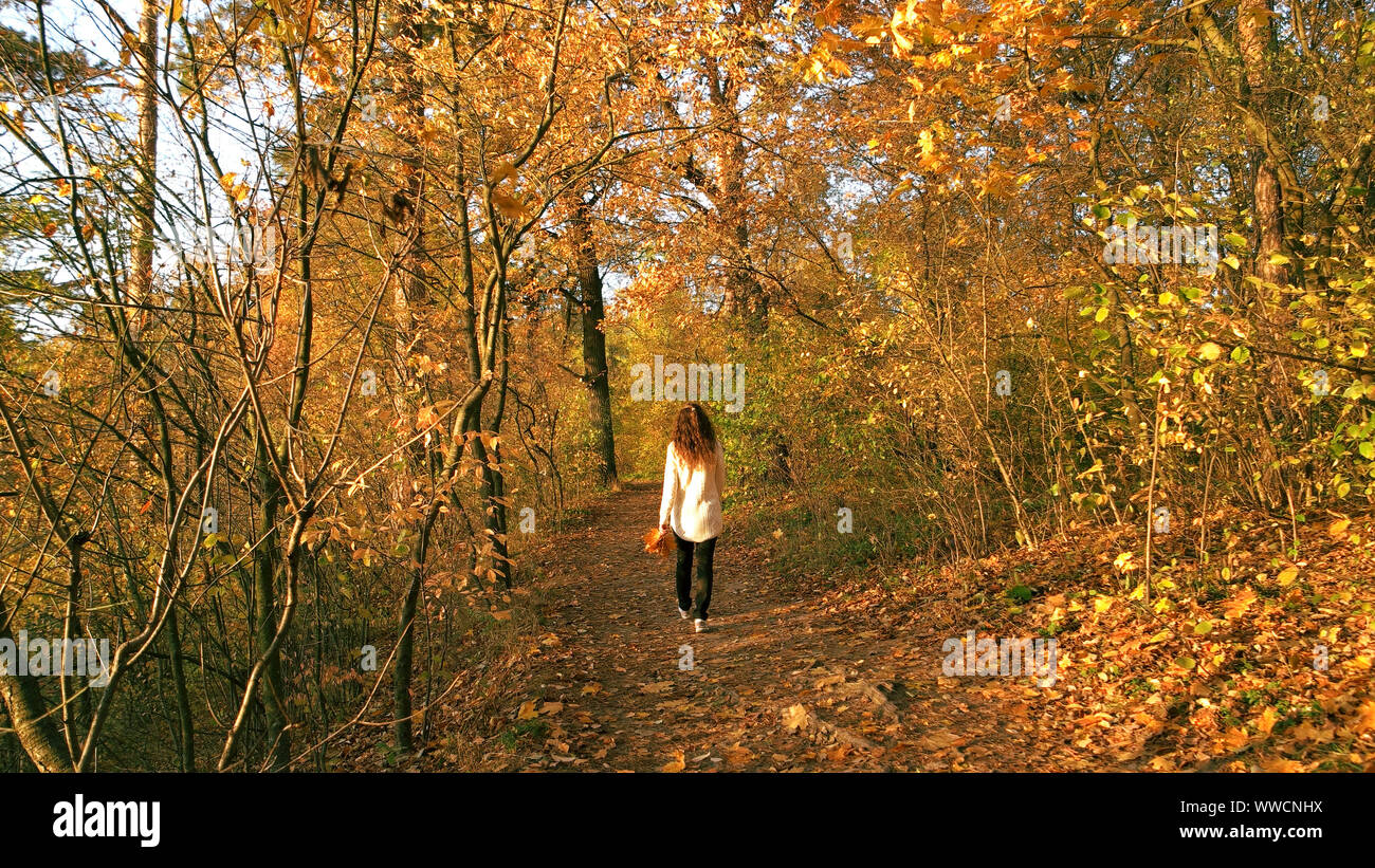 Woman alone on pathway hi-res stock photography and images - Alamy