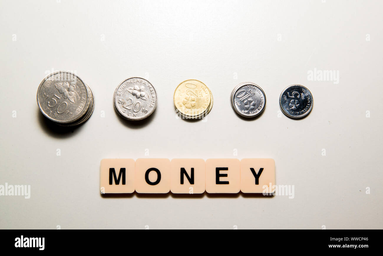 Money sign background with coins Stock Photo - Alamy