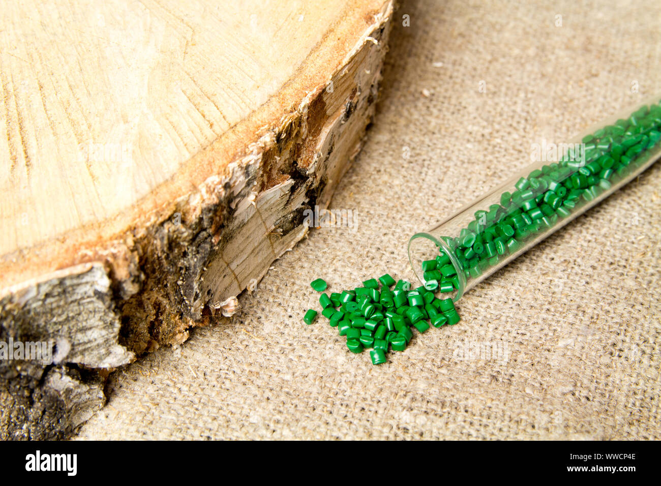 Plastic pellets .Polymeric dye in test tubes on gray background ...