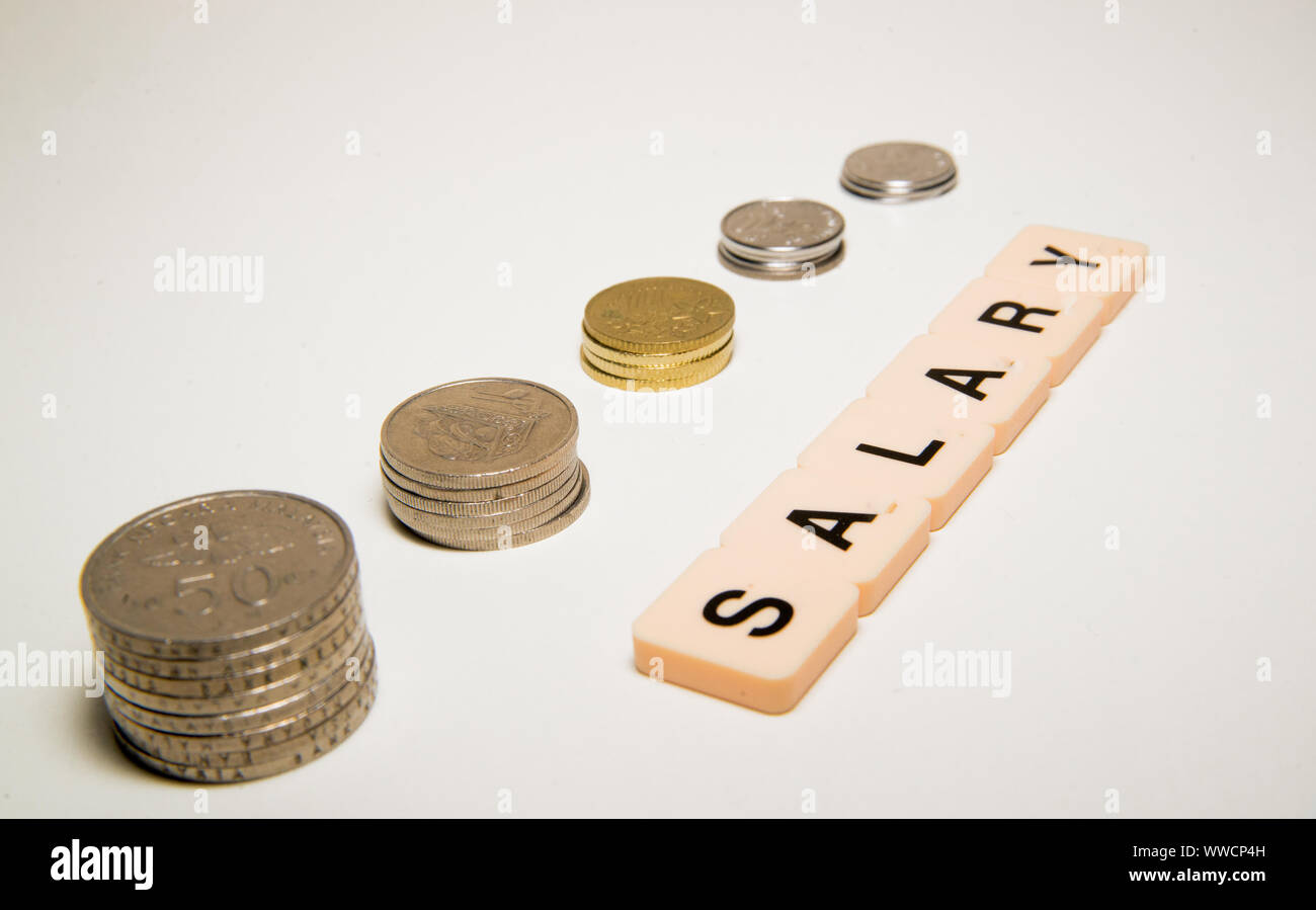 Salary sign background with coins Stock Photo - Alamy
