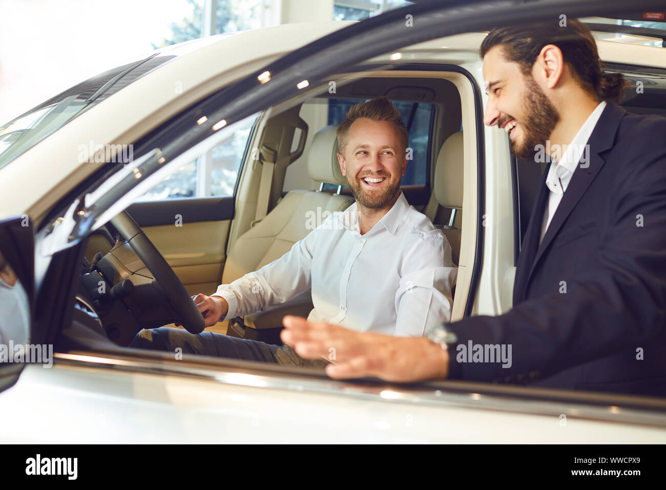 Salesman showing new car to client hi-res stock photography and images ...