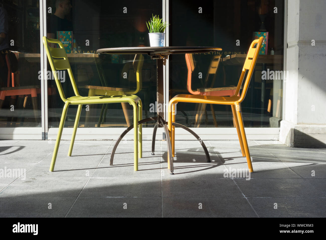 Colourful table and chairs Stock Photo - Alamy
