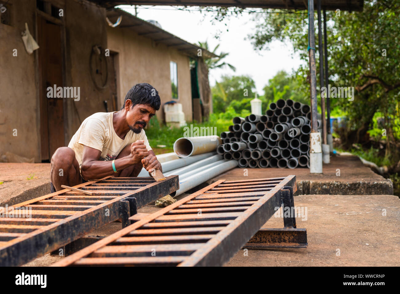 Chinchinim, Goa/India- July 29 2019: Local fishermen working on getting ...