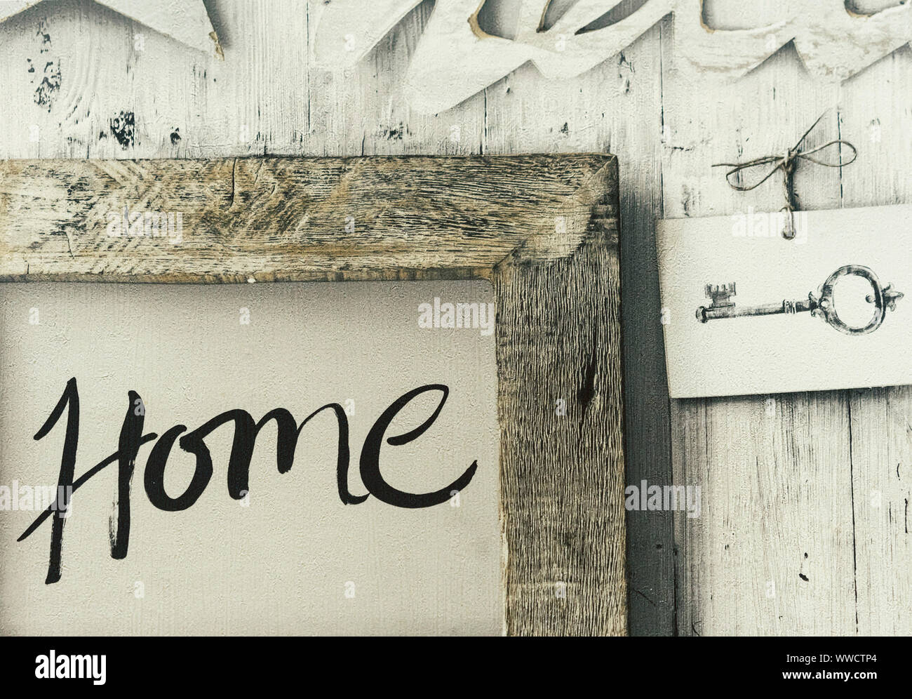 Picture with the words "Home" in a rough wooden frame Stock Photo - Alamy