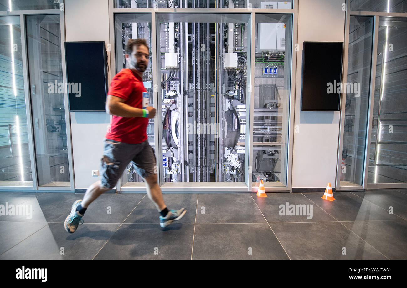 Rottweil, Germany. 15th Sep, 2019. A runner runs past shafts for ...