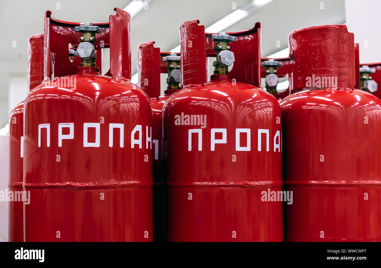 Red cylinders of propane gas. The inscription in Russian - propane ...