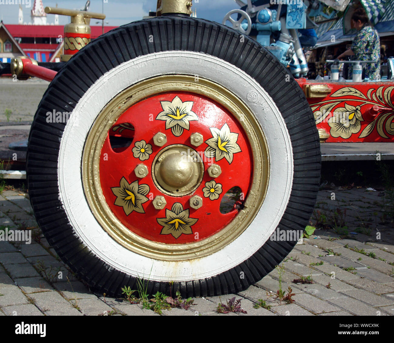 The wheel is painted in Russian folk style Stock Photo - Alamy
