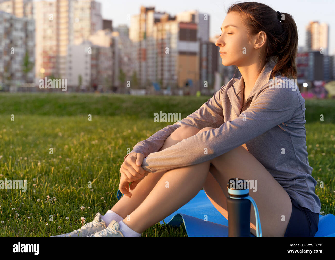 Calm girl after an intense workout resting Stock Photo - Alamy