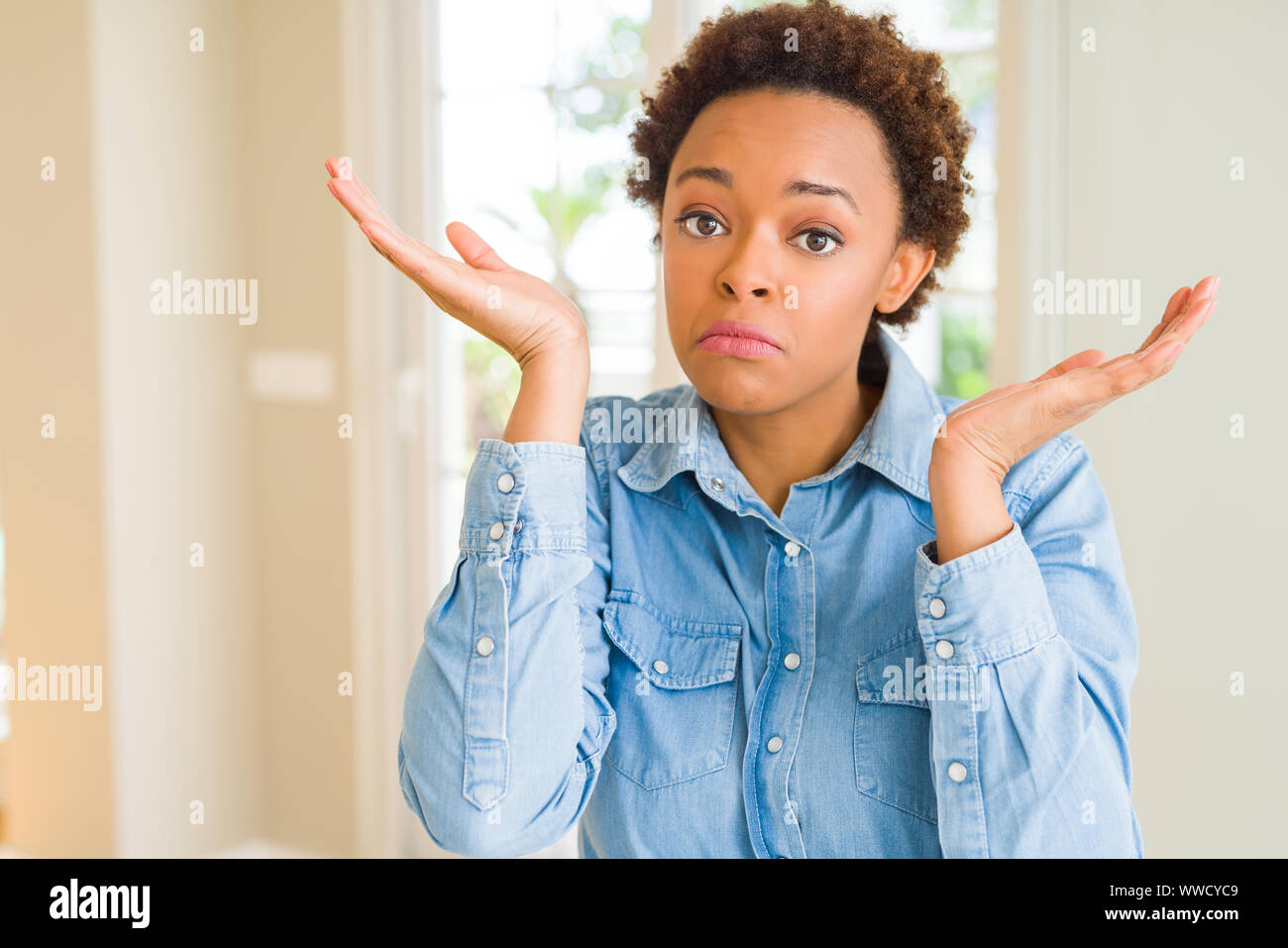 Young beautiful african american woman clueless and confused expression ...