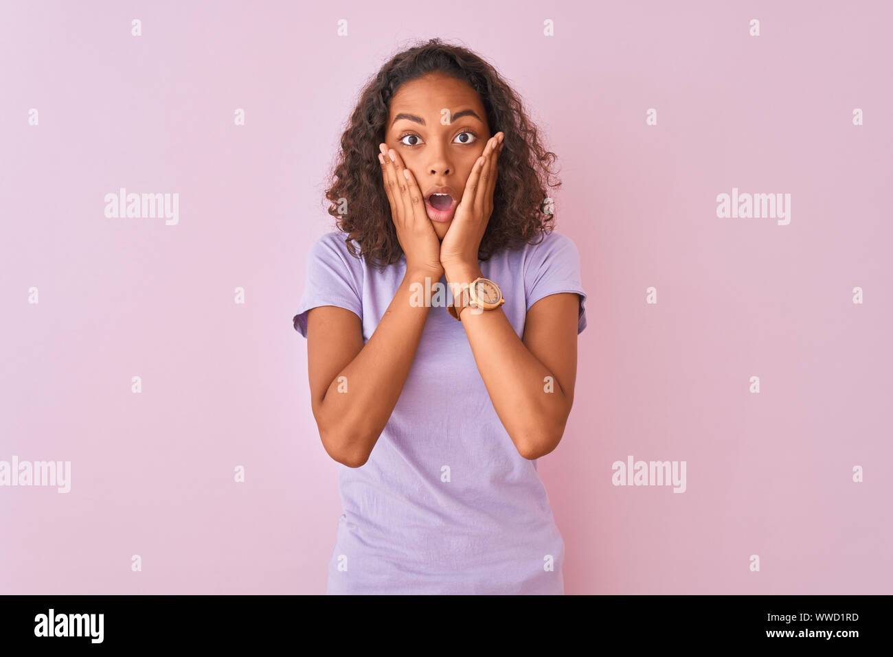 Young Brazilian Woman Wearing T Shirt Standing Over Isolated Pink