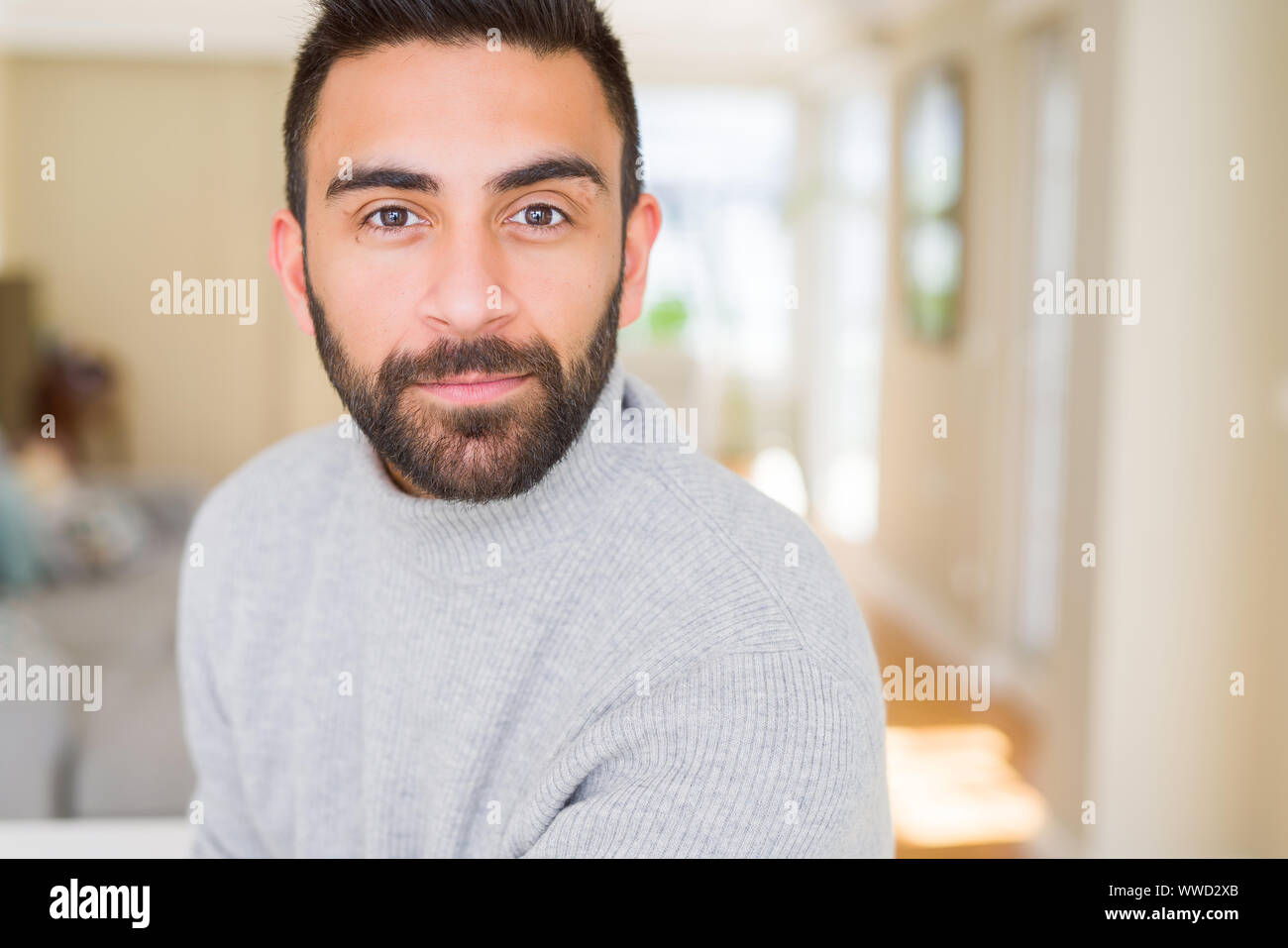 Handsome man looking relaxed and confident Stock Photo - Alamy