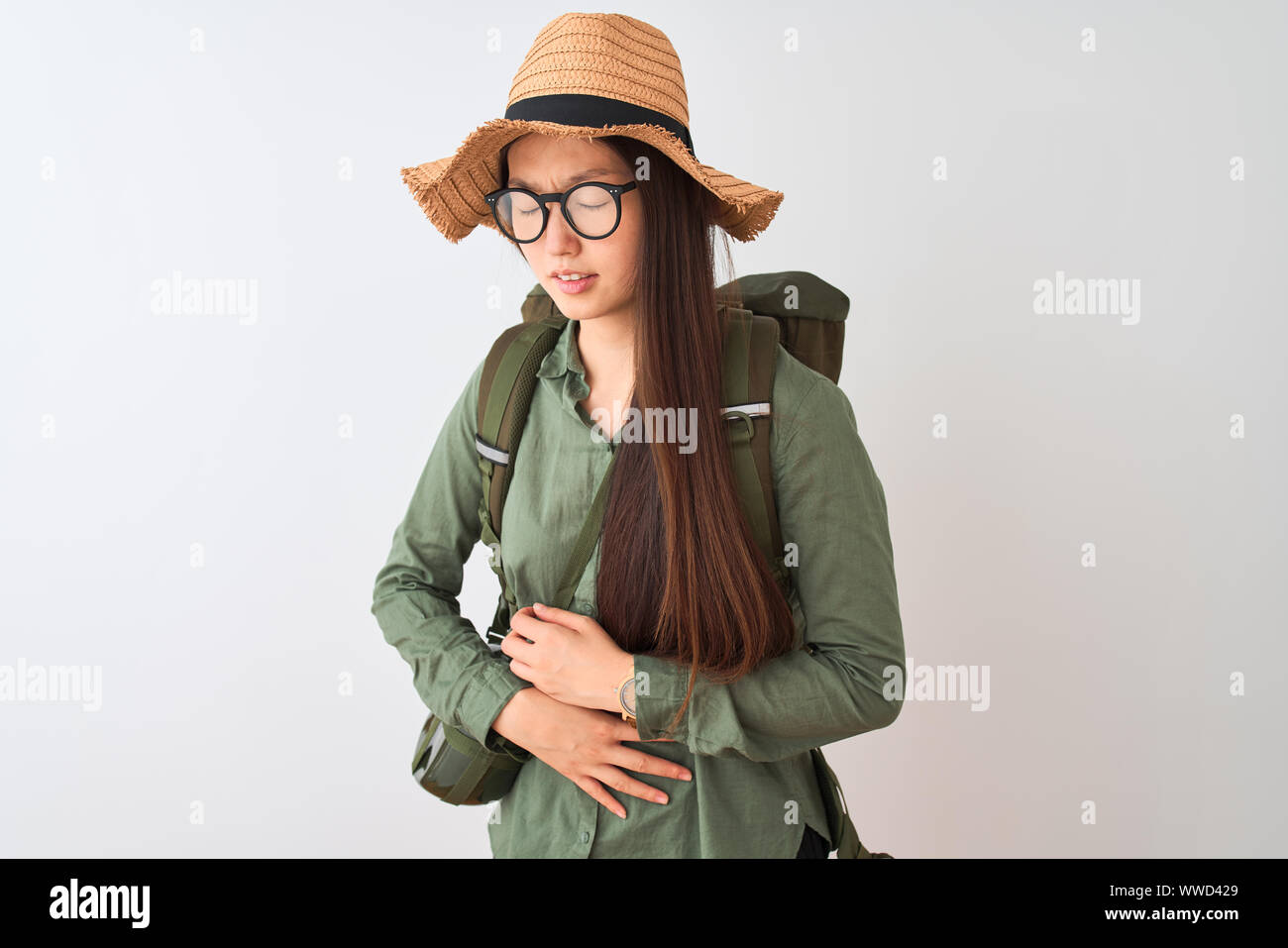 Chinese hiker woman wearing canteen hat glasses backpack over isolated ...