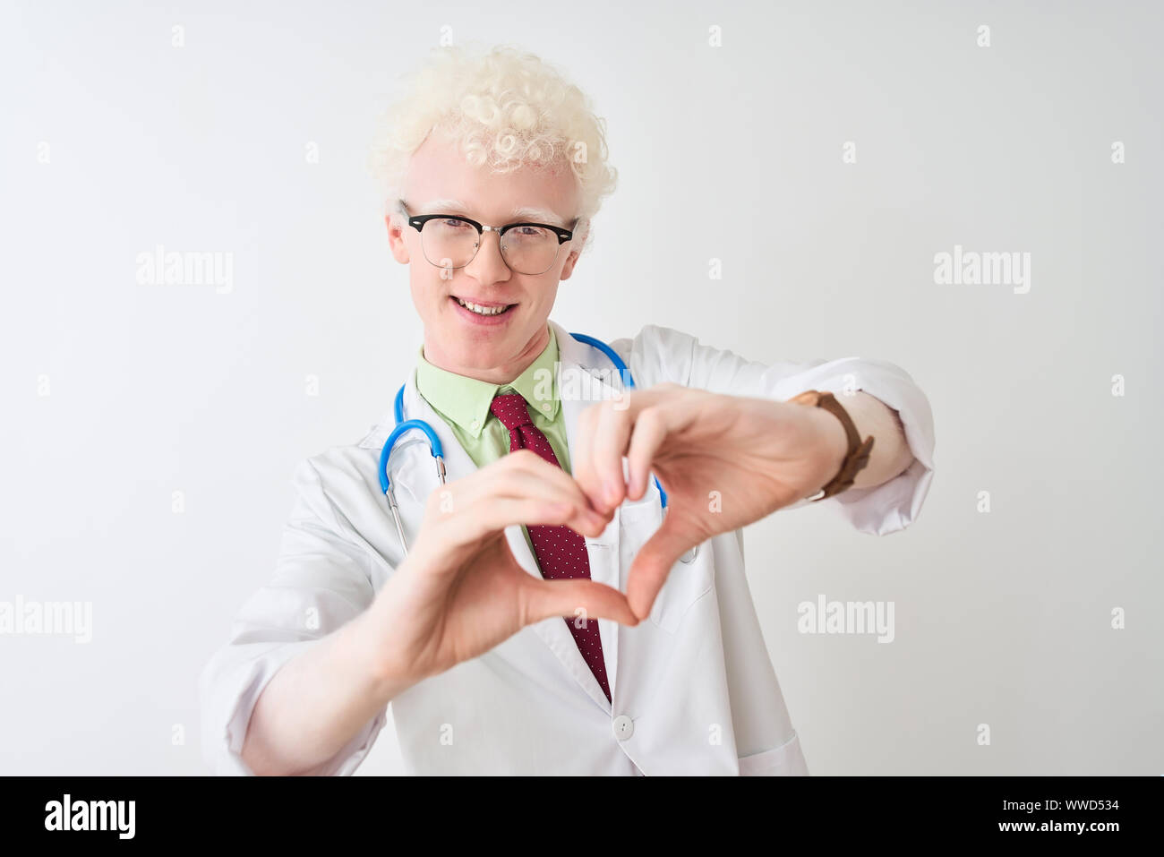 Young albino doctor man wearing stethoscope standing over isolated ...