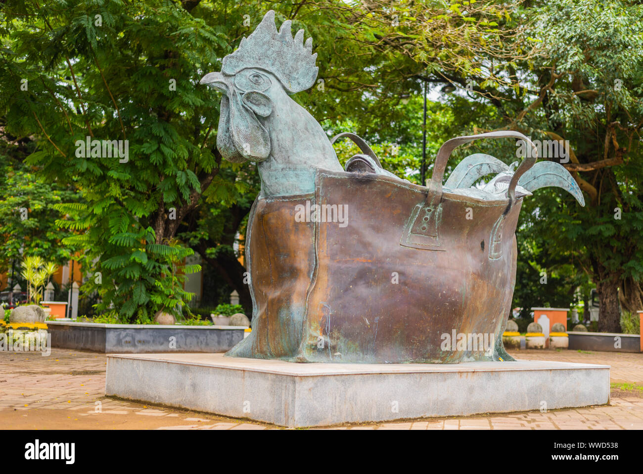 Carvings of a Rooster and some fish stuffed inside a carry bag in ...