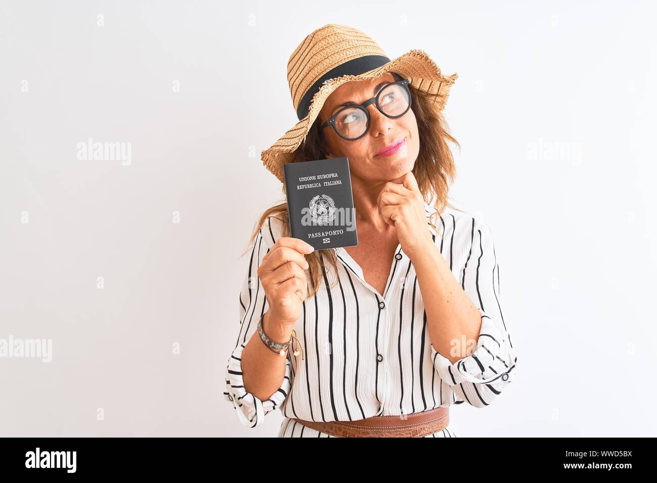 Senior tourist woman holding Italy Italian passport standing over ...