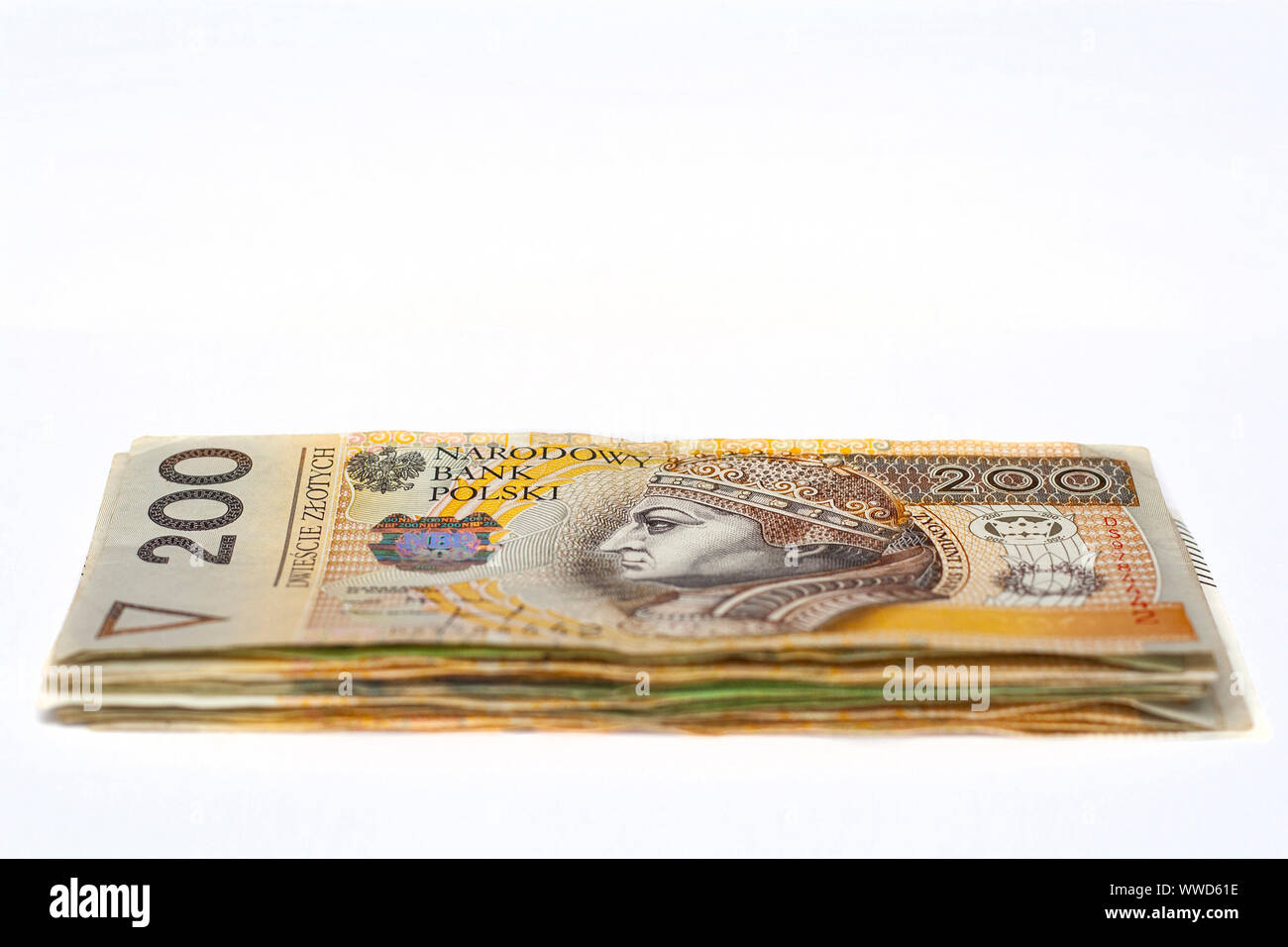 Stack of polish banknotes with two hundred zloties banknote on top on ...